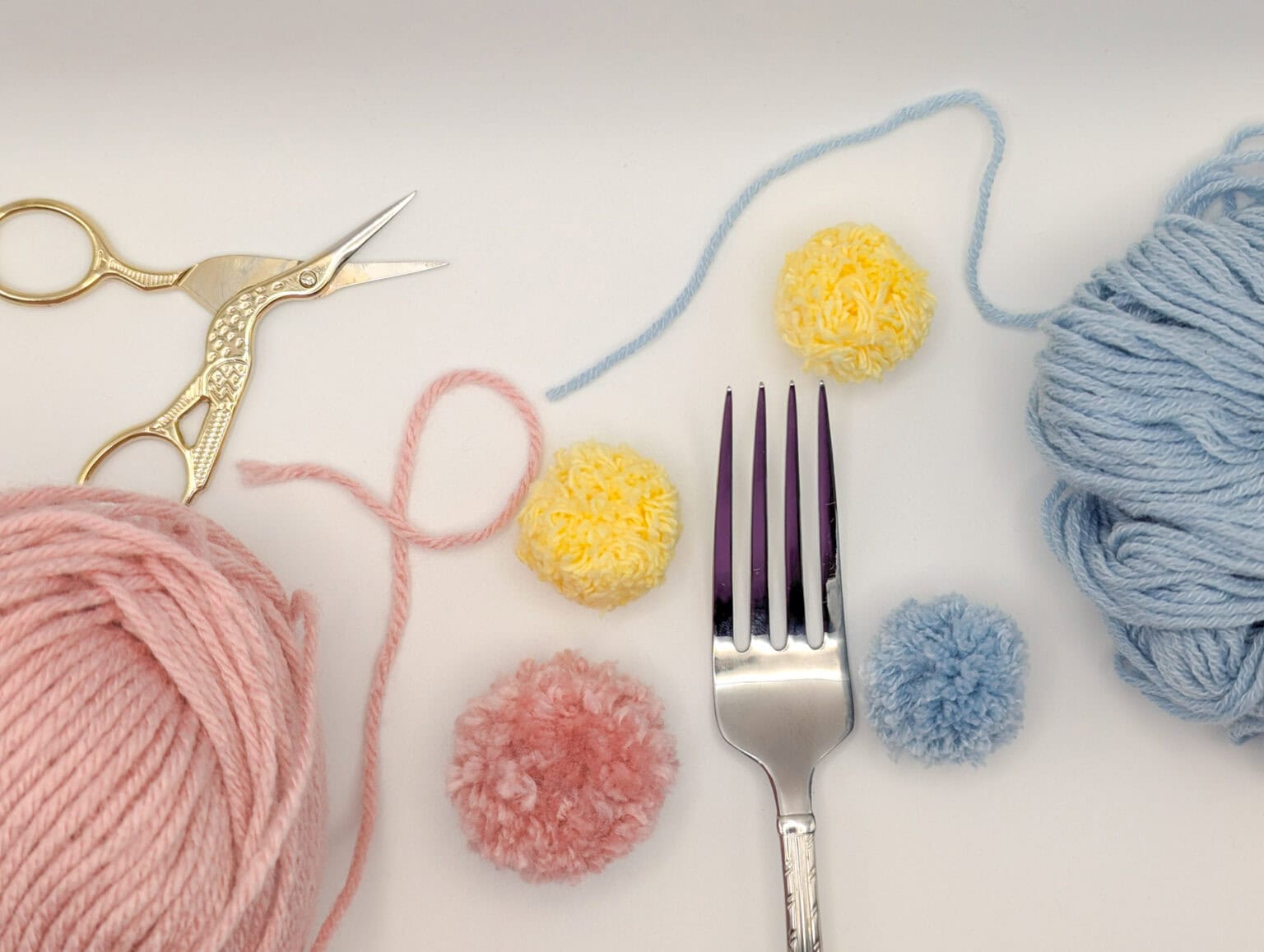 How to Make quick little Pom Poms Using Just a Fork (No Special Tools ...